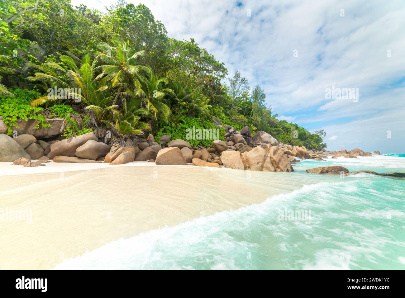 Famous Anse Georgette beach under a cloudy sky. Praslin island ...