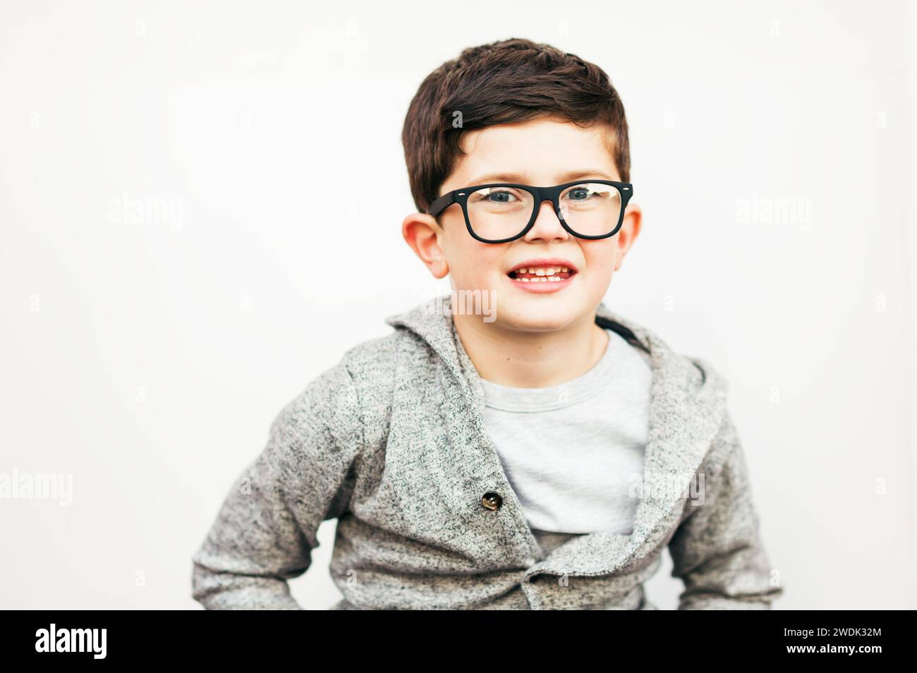 Outdoor portrait of a cute little boy wearing eyeglasses Stock Photo - Alamy