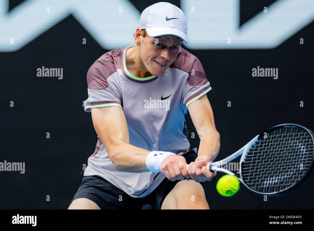 Melbourne, Australia. 21st Jan, 2024. Jannik Sinner hits a return during the men's singles ...