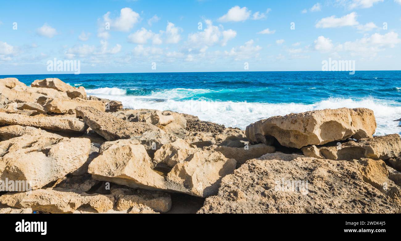 Yellow rocks by the shore in Sardinia, Italy Stock Photo - Alamy