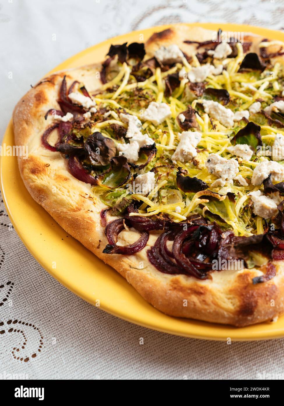 Home made vegan brussels sprouts pizza with red onions Stock Photo - Alamy