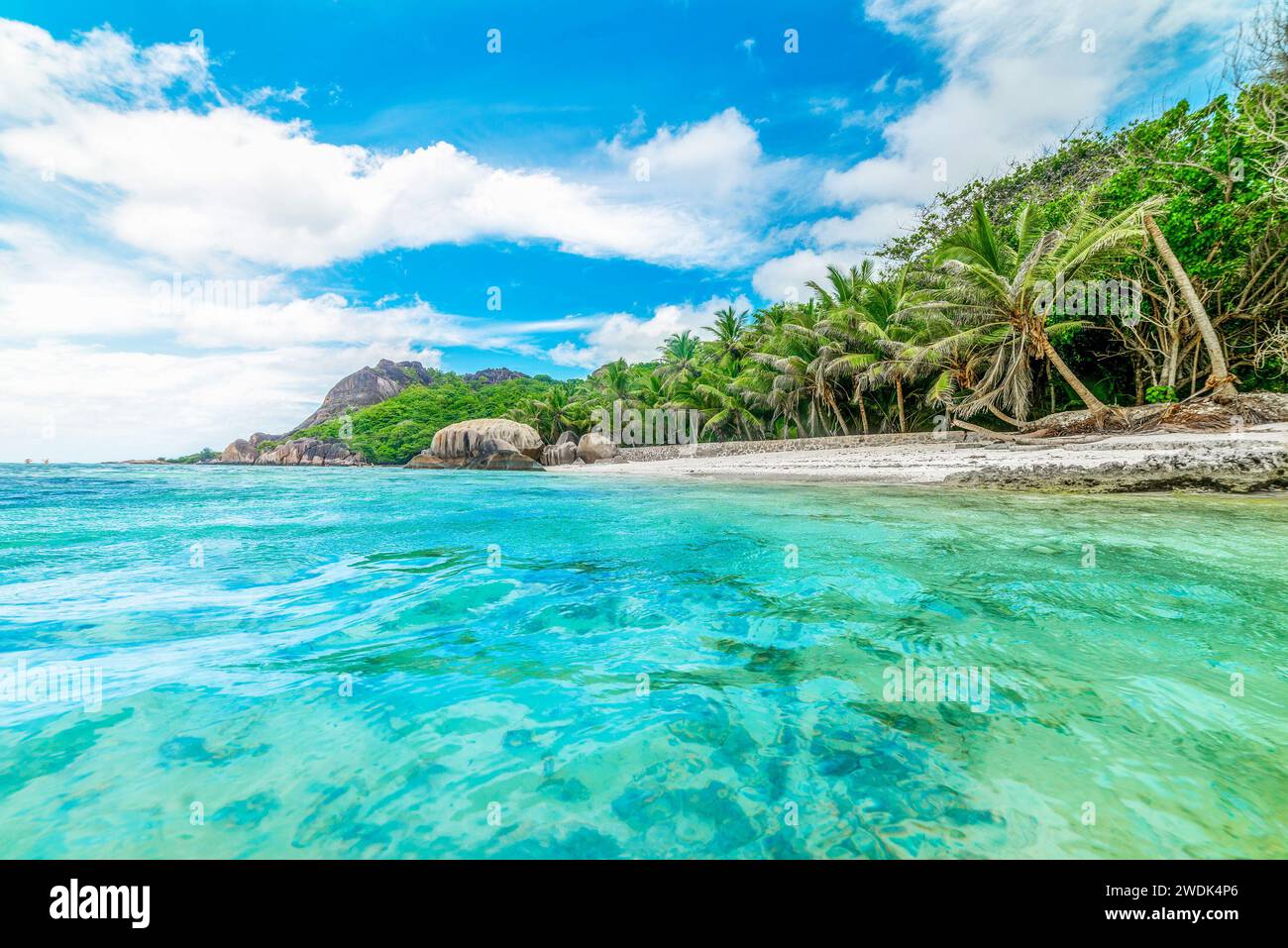 Anse source d'argent beach seen from the water. La Digue island ...