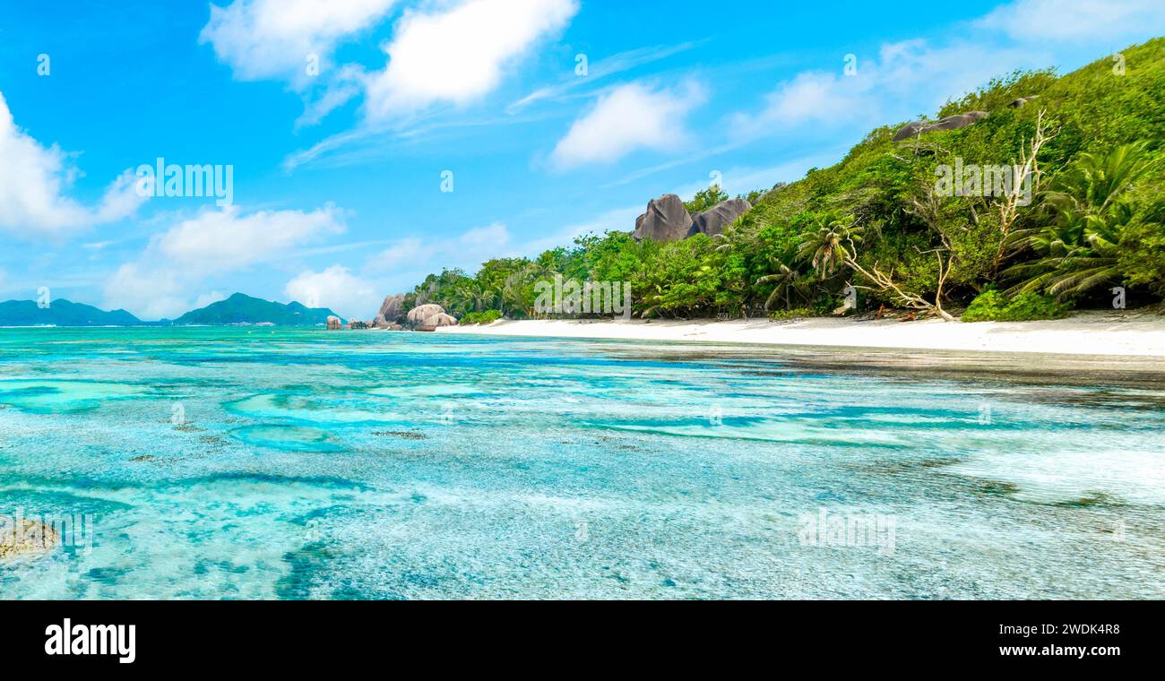 Coral reef and white sand in Anse Source d'Argent beach. La Digue ...