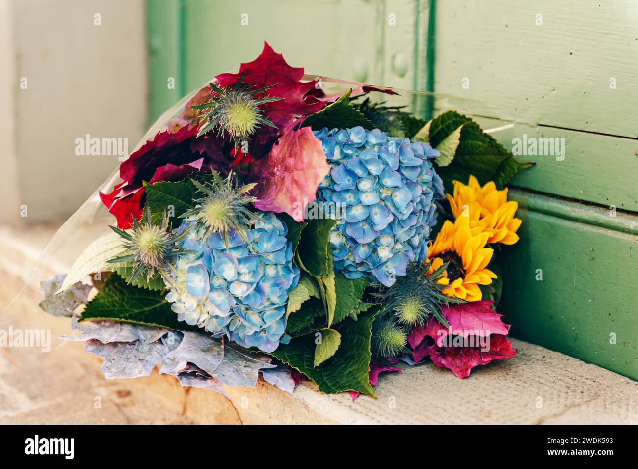 Autumn bouquet of sunflowers and blue hydrangea Stock Photo - Alamy
