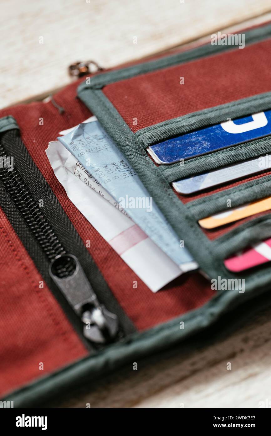 Receipts in a textile wallet Stock Photo - Alamy
