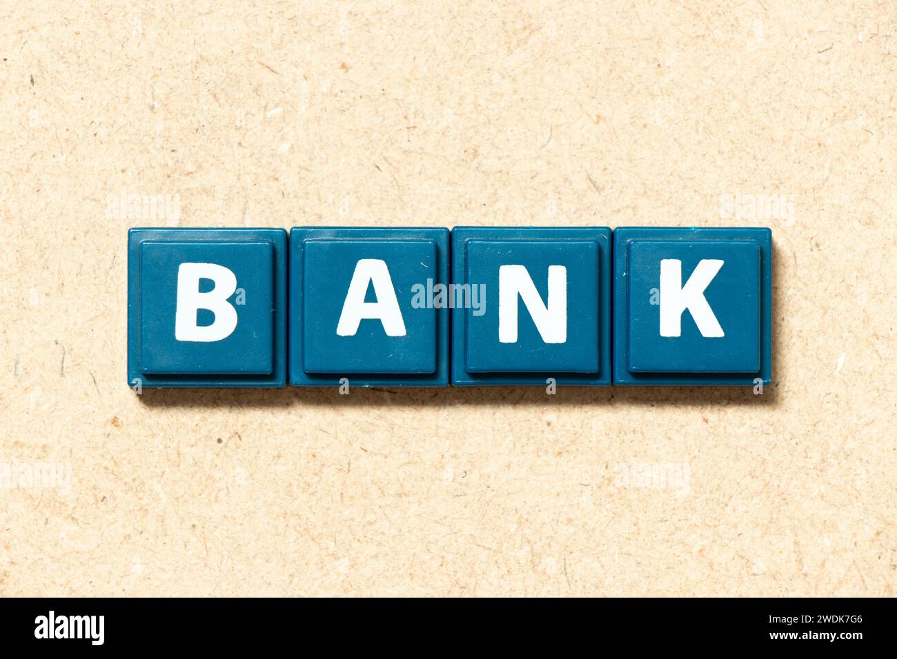 Tile alphabet letter in word bank on wood background Stock Photo - Alamy