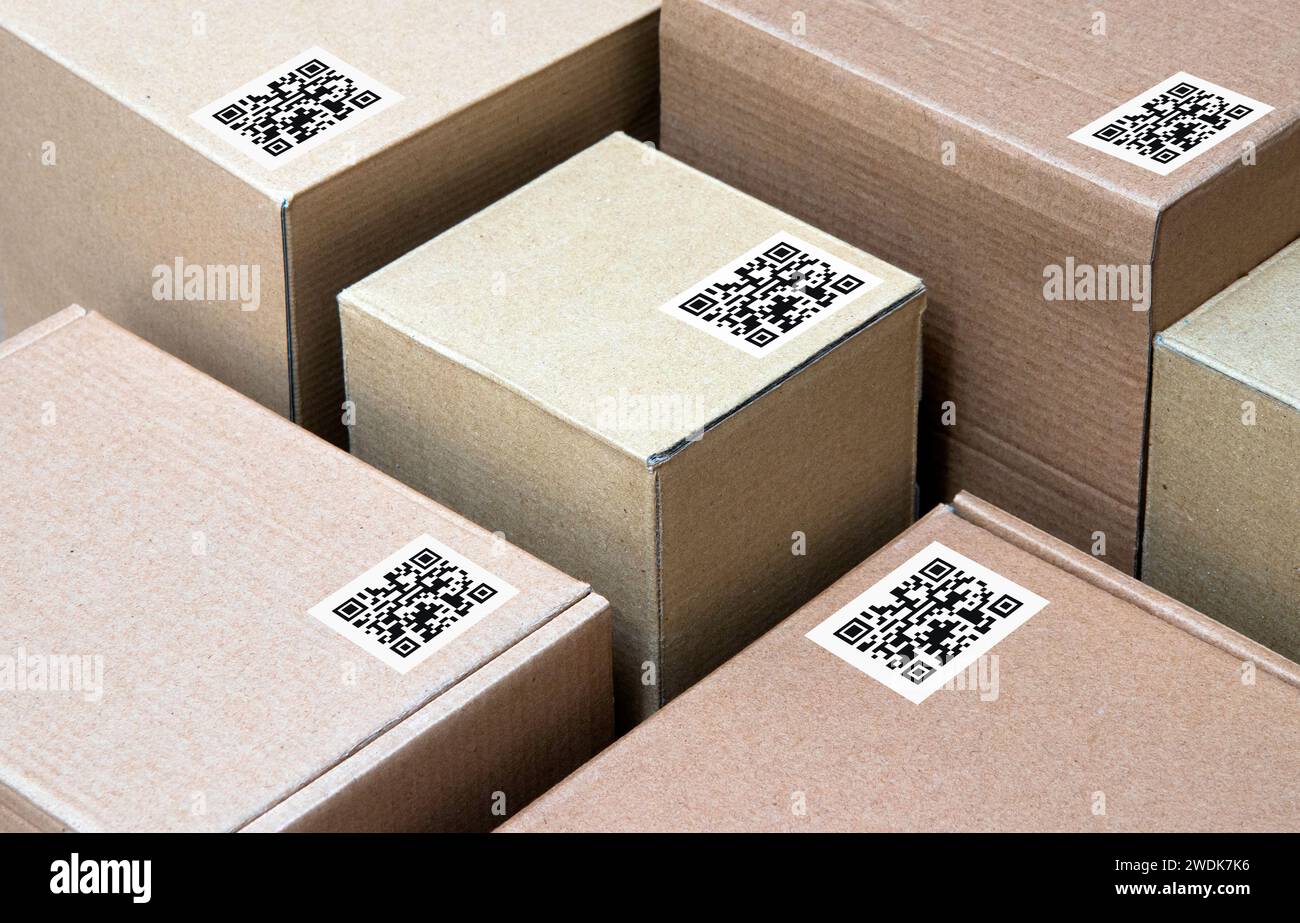 Cardboards labeled with QR Codes. Delivery parcels labeling Stock Photo ...