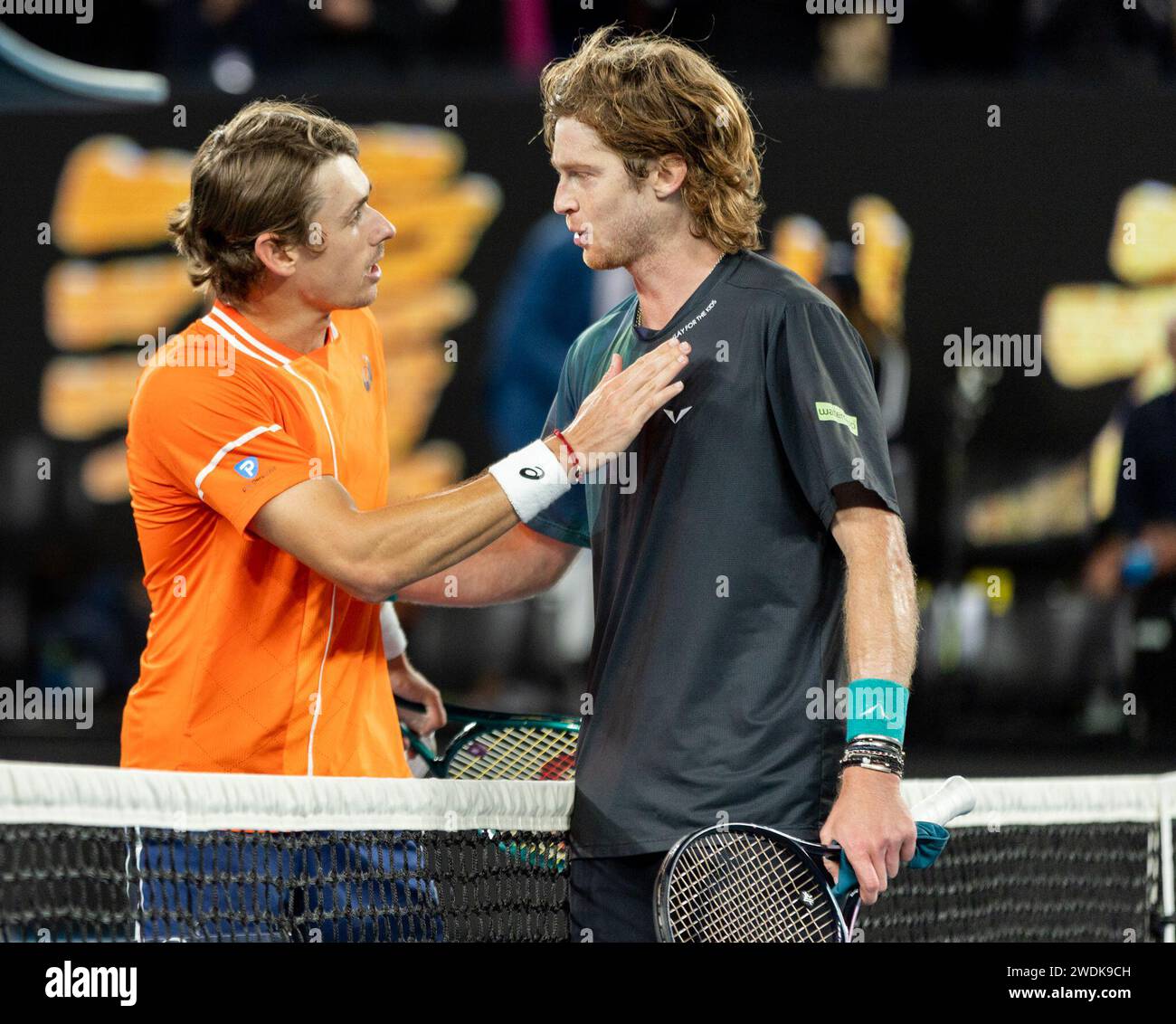 Melbourne, Australia. 21st Jan, 2024. Andrey Rublev (R) of Russia and Alex De Minaur of ...