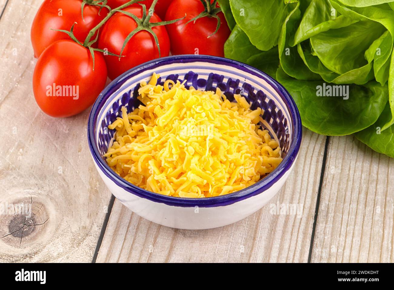 Shredded yellow cheese in the bowl Stock Photo - Alamy