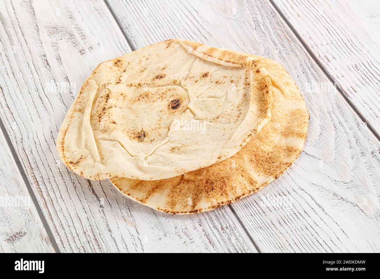 Traditional eastern round pita bread for breakfast Stock Photo - Alamy