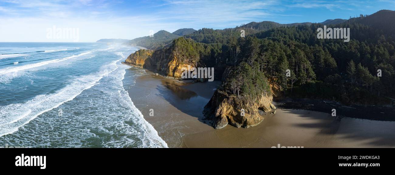 Sunlight shines on the coast of Oregon near Hug Point. This scenic ...