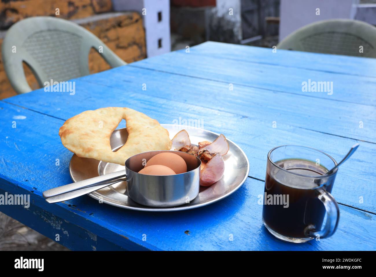 Gurung bread and eggs with the nepali black tea, a traditional Nepali ...