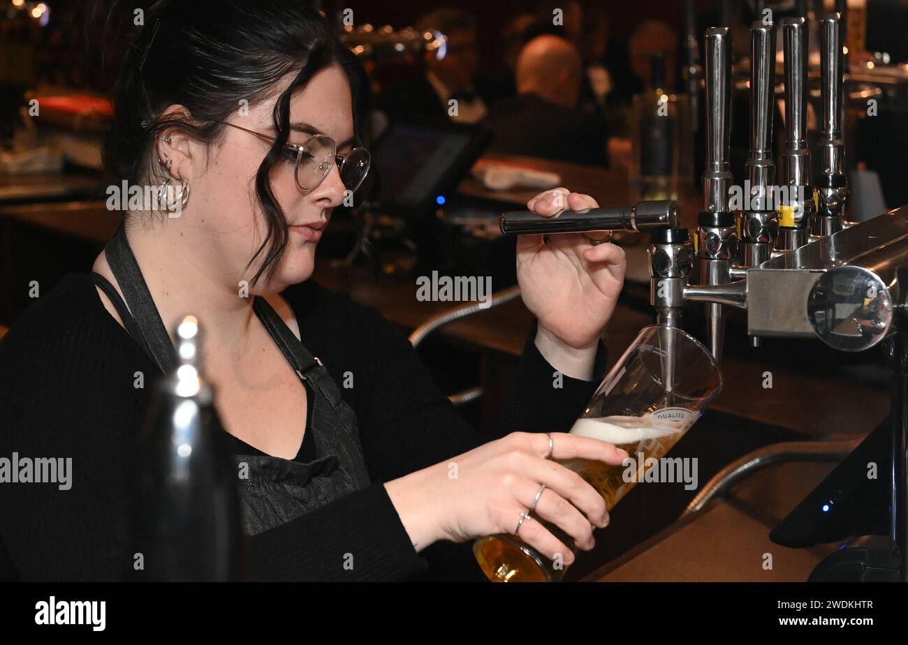 A barmaid pull a pint during the London Scottish Football Club 2024 ...