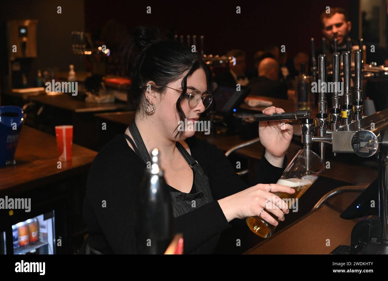 A barmaid pull a pint during the London Scottish Football Club 2024 ...