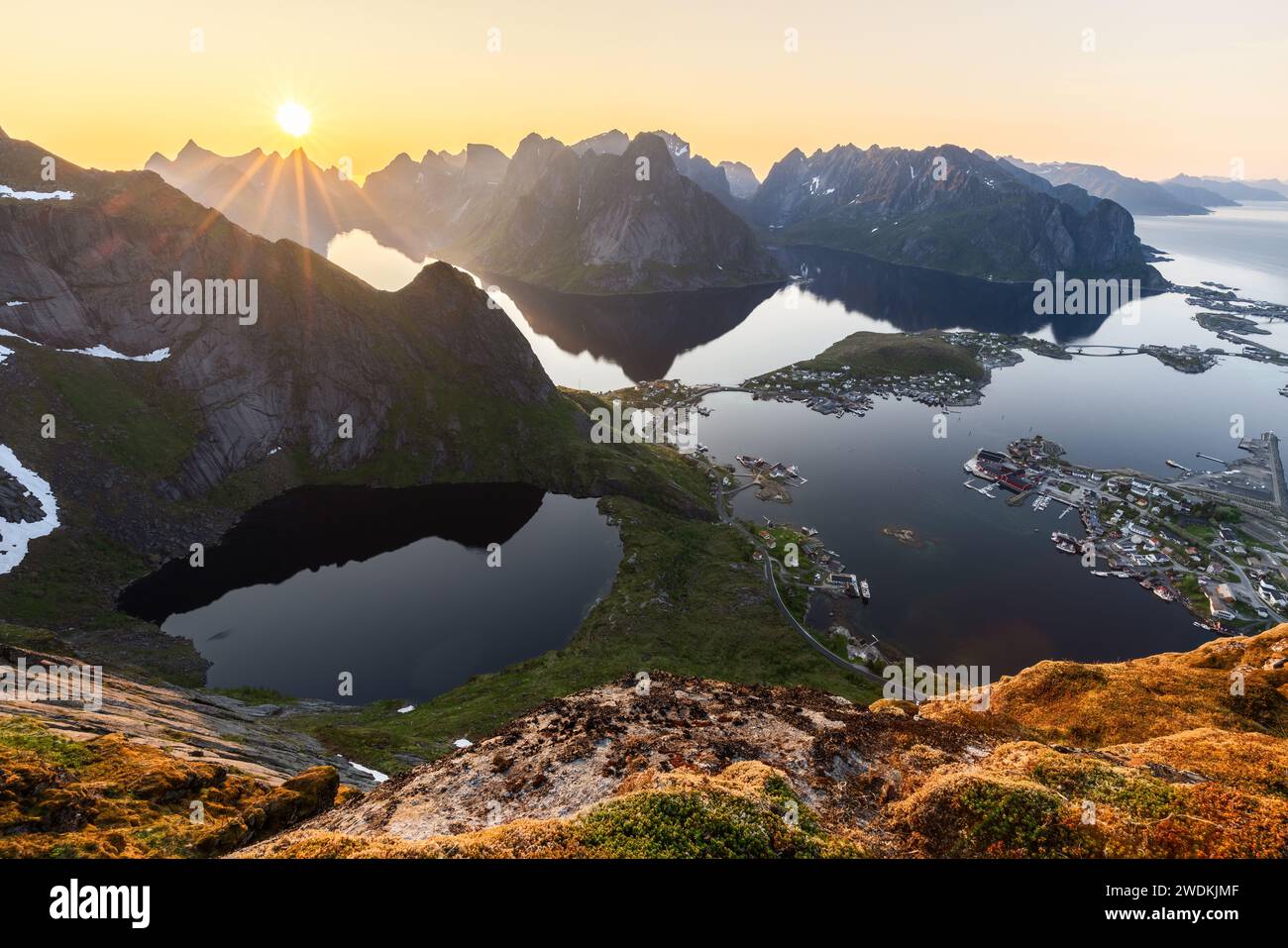 Golden hour glow blankets Reinebringen, Lofoten Islands, with the ...