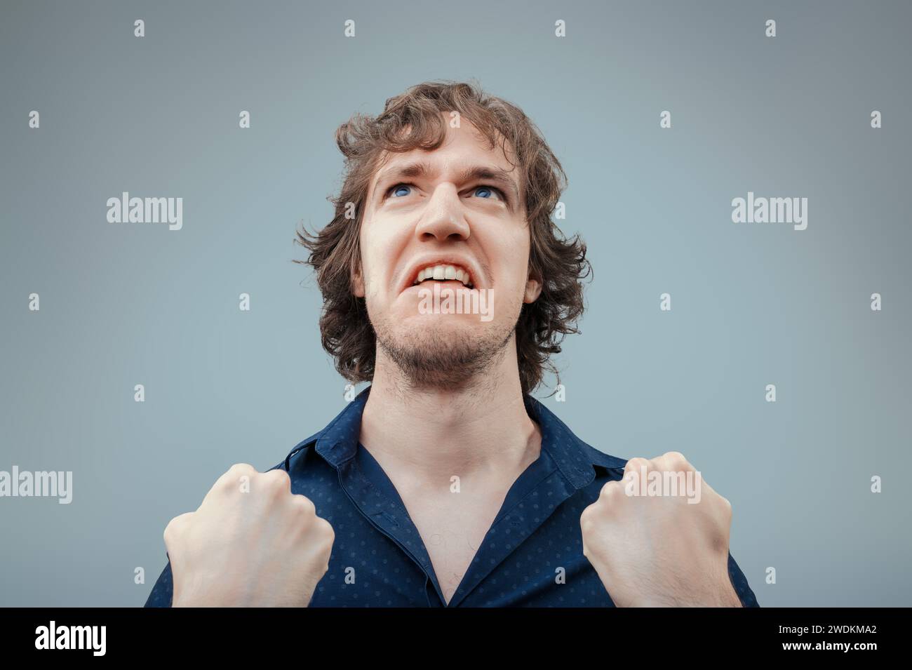 His visage conveys a readiness to face the obstacles ahead, fists ...