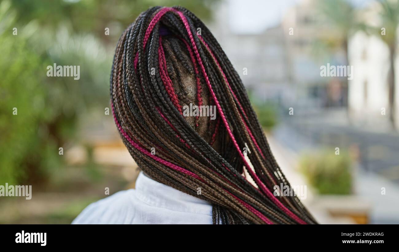 Beautiful african american woman casually standing backwards in a ...