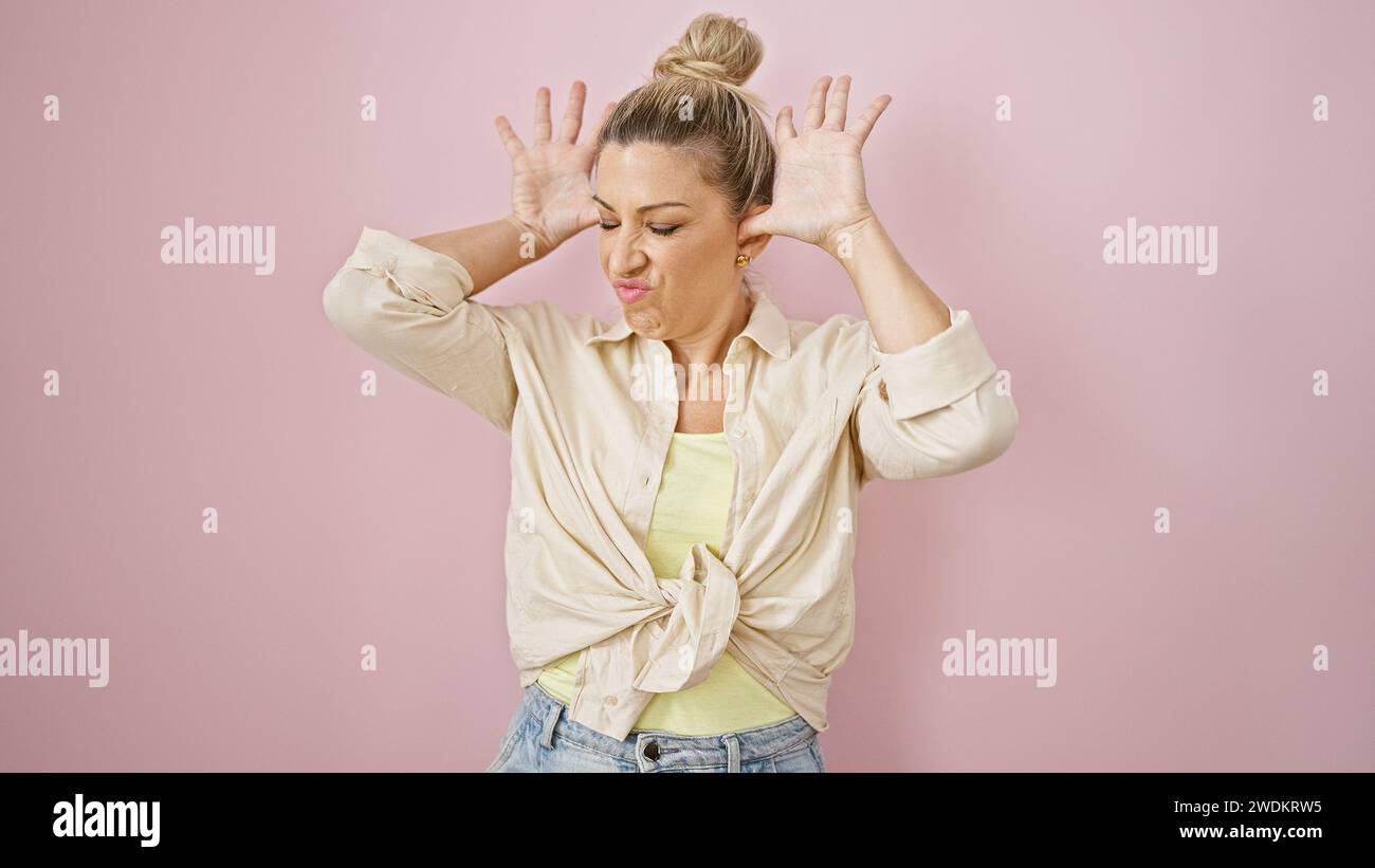 Young blonde woman doing derision hi-res stock photography and images ...