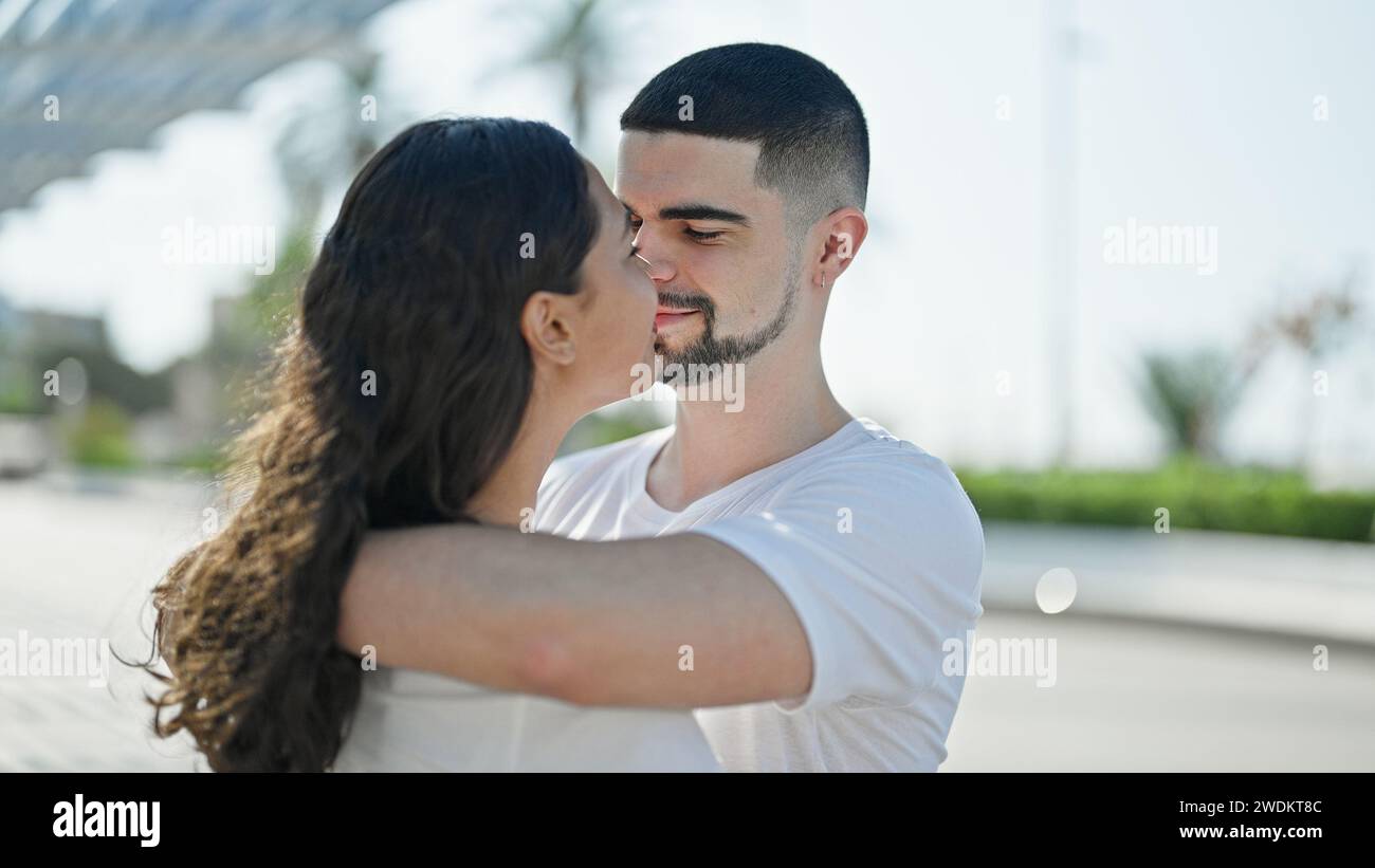 Beautiful, confident couple, smiling and hugging, deeply looking into ...