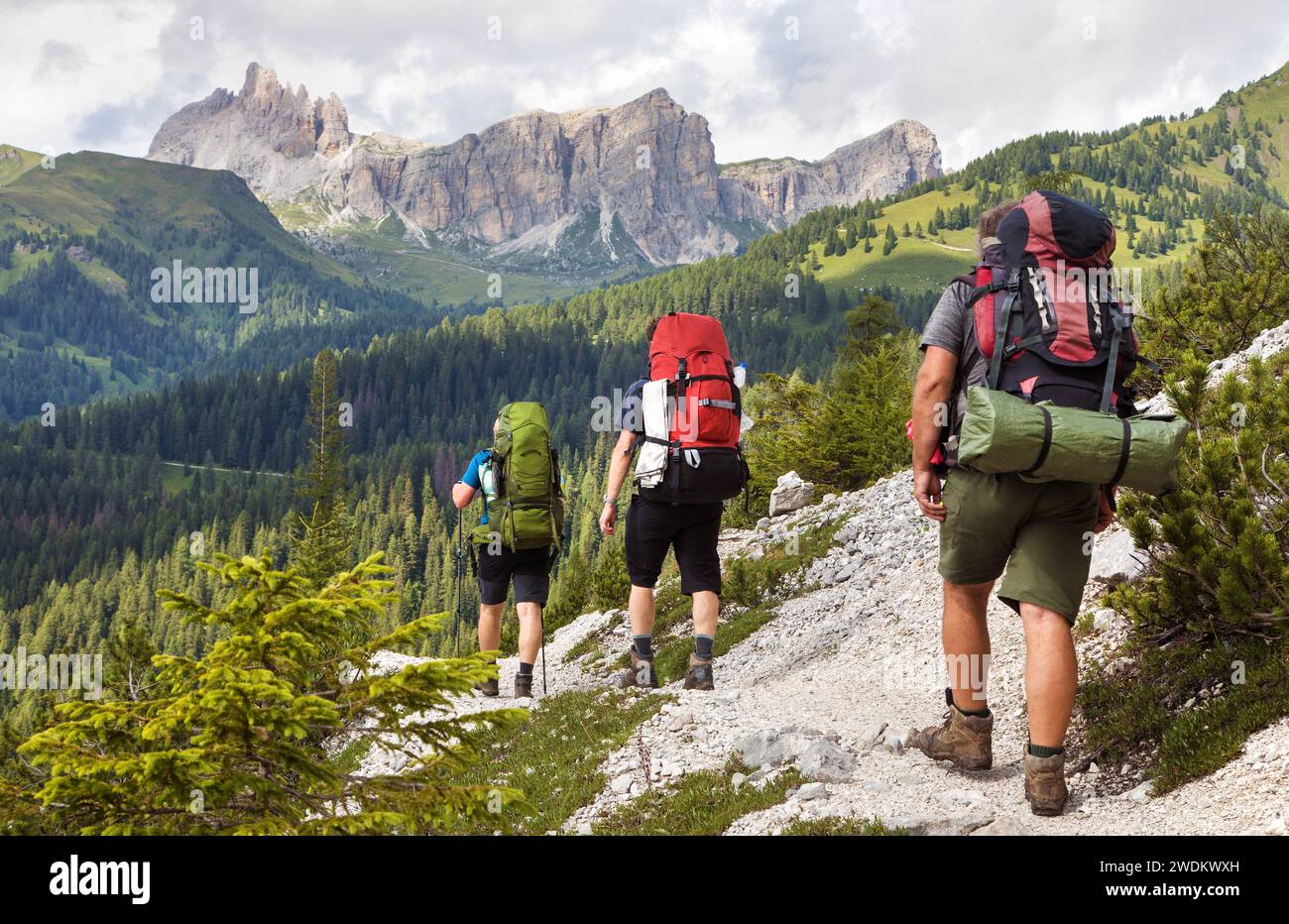 Group of hikers and Alps Dolomites mountains, Italy Stock Photo - Alamy
