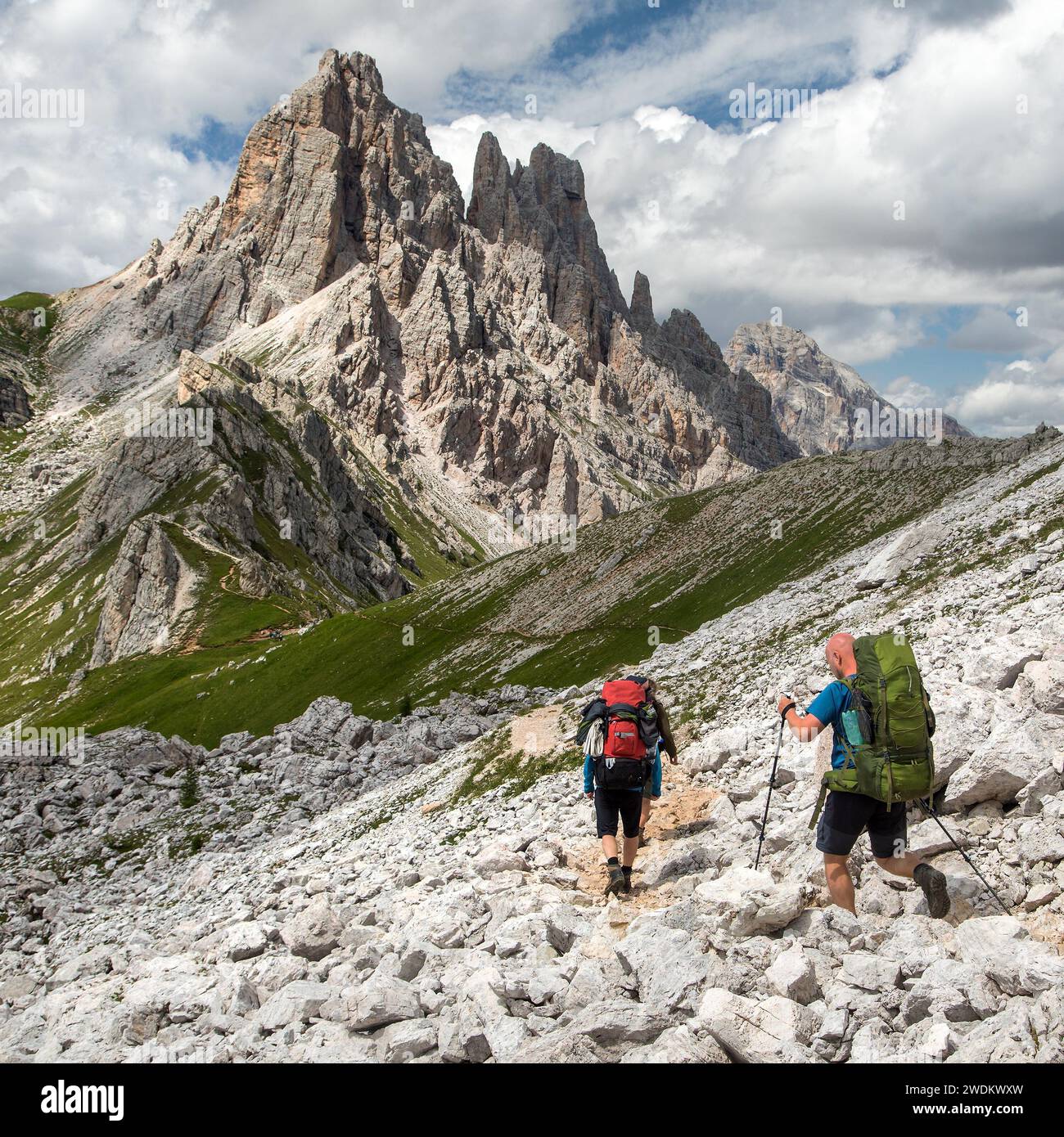 Cima Ambrizzola and Croda da Lago with three hikers, Alps Dolomites ...