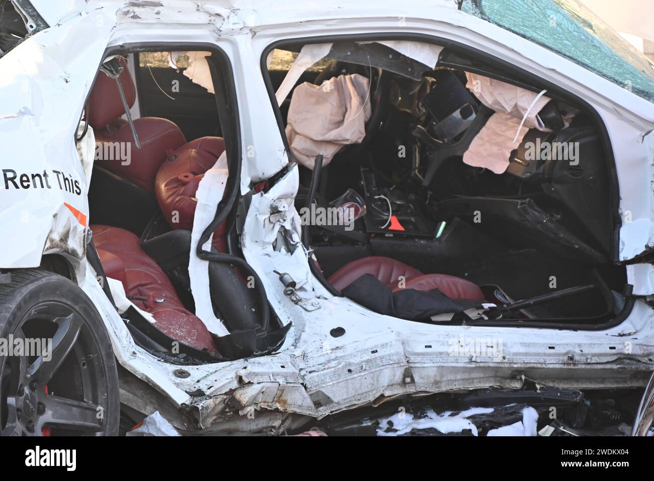 White Chrysler vehicle seen damaged from the crash. Fatal vehicle ...