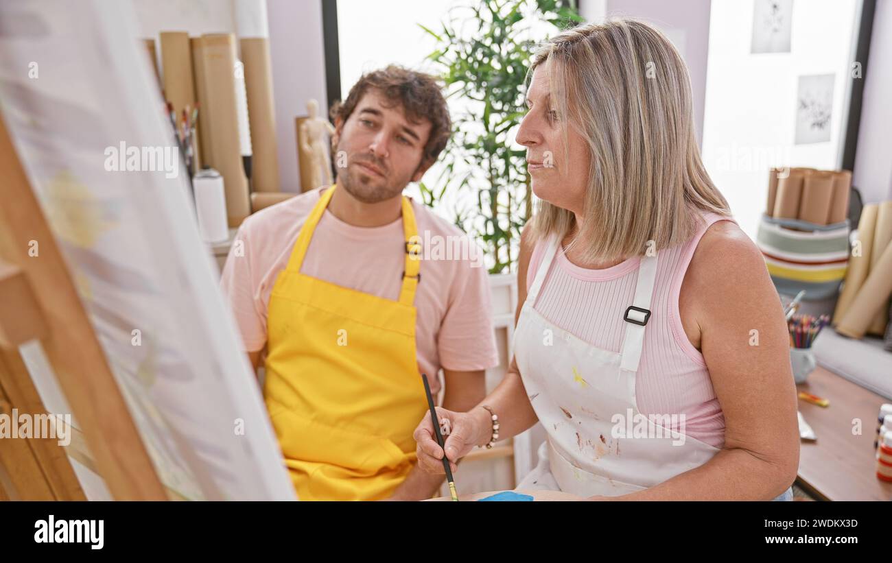 In the heart of creativity, two confident artists, man and woman ...