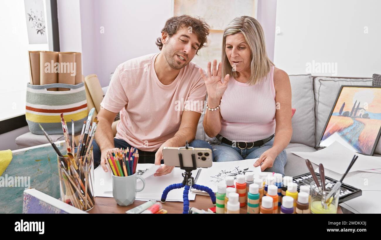 Mother and son sitting together in art studio, sharing a loving moment ...