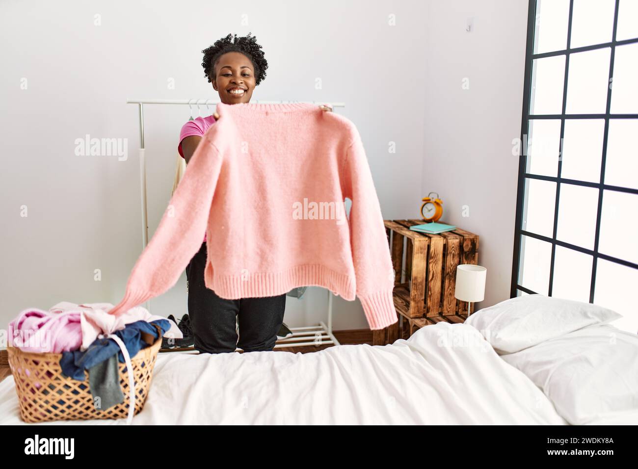 Person doing laundry home folding hi-res stock photography and images ...