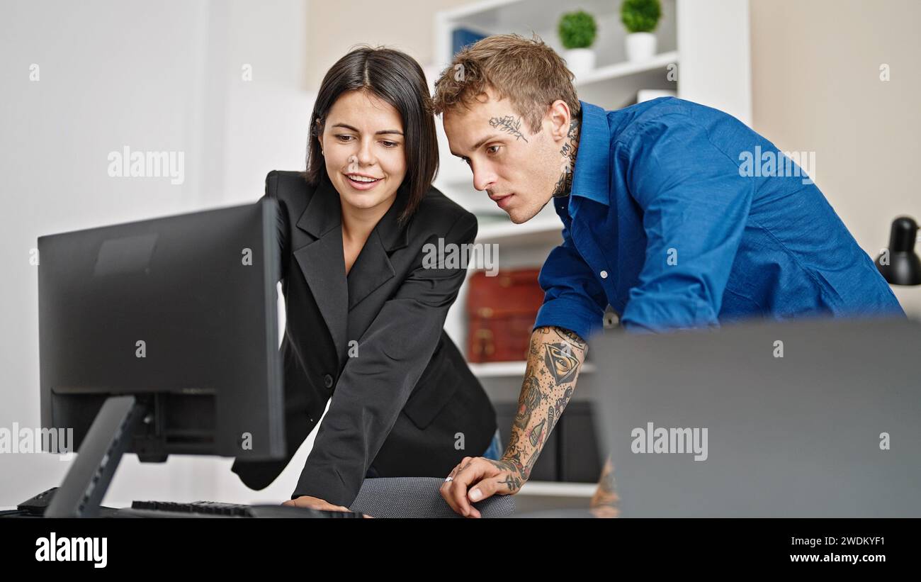Two business workers using computer working at the office Stock Photo ...
