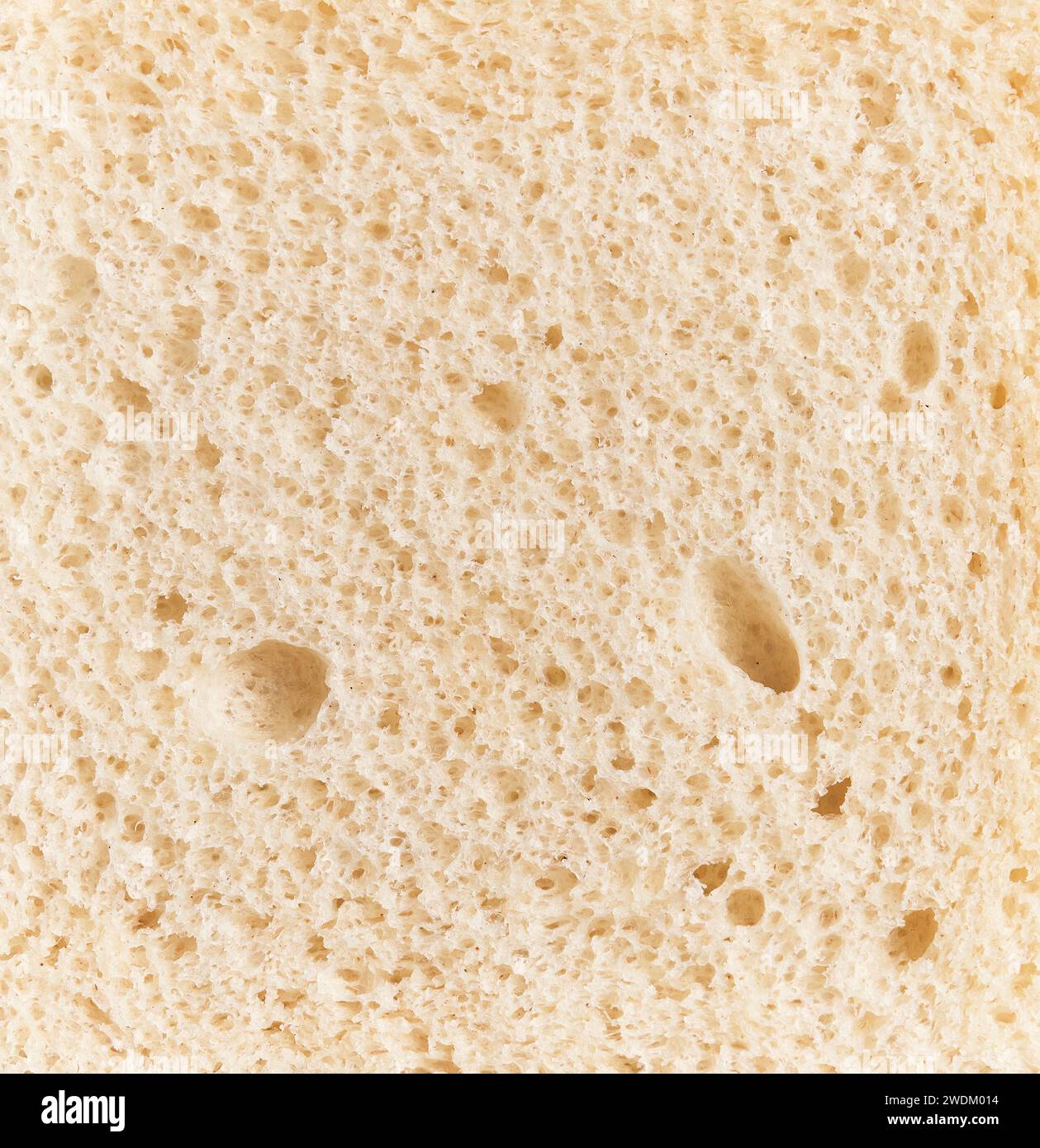 Close-up view of sliced bread highlighting its texture and porous ...