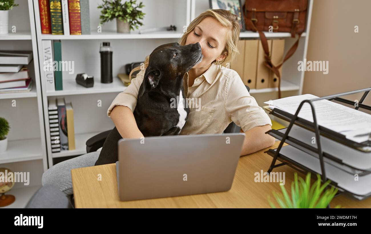 A caucasian woman in a modern office lovingly interacts with her black ...