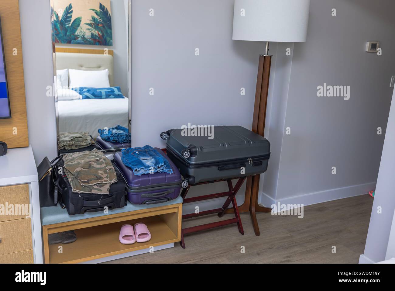 View of the hotel room interior with suitcases placed in designated ...