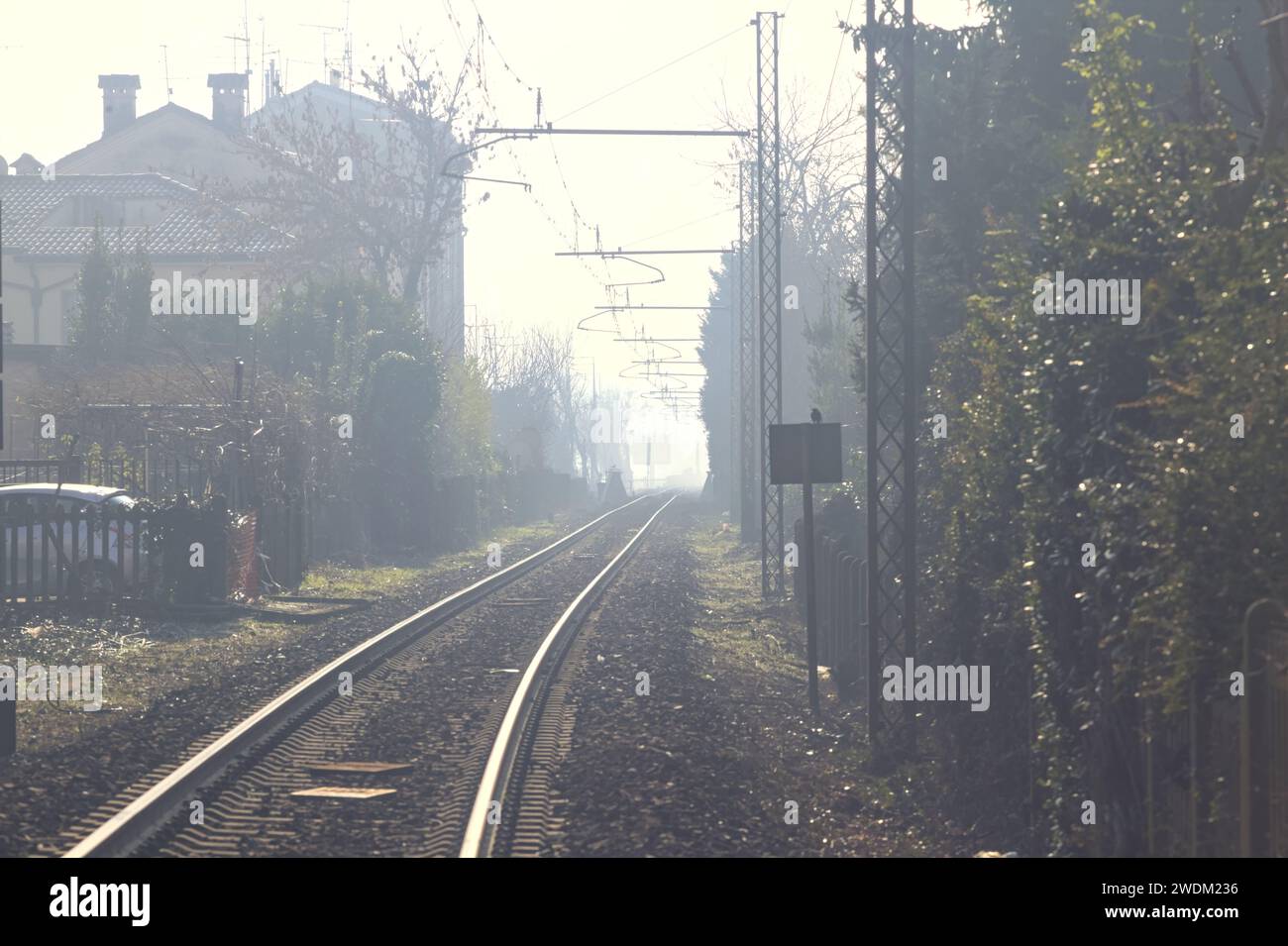Railroad track passing through a village Stock Photo - Alamy