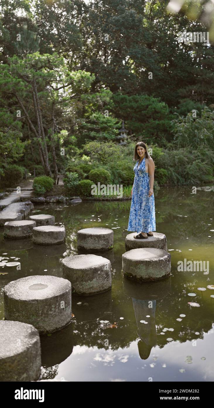 Beautiful hispanic woman's leisurely summer walk along stone path ...