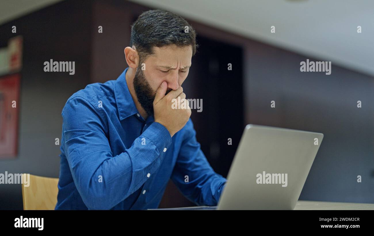 Young hispanic man business worker coughing working at the office Stock ...