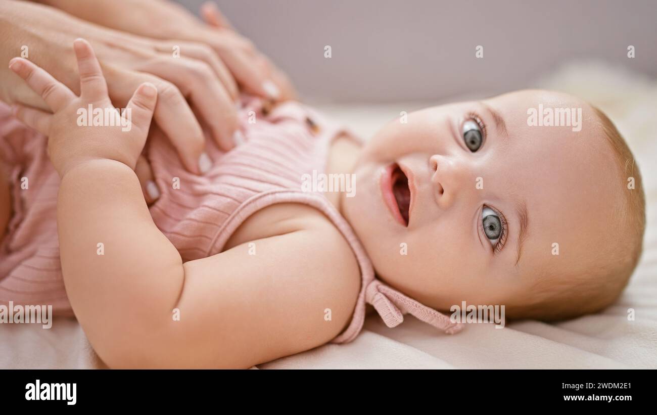 Heartwarming moments at home, a loving mother, casually dressed, casts ...