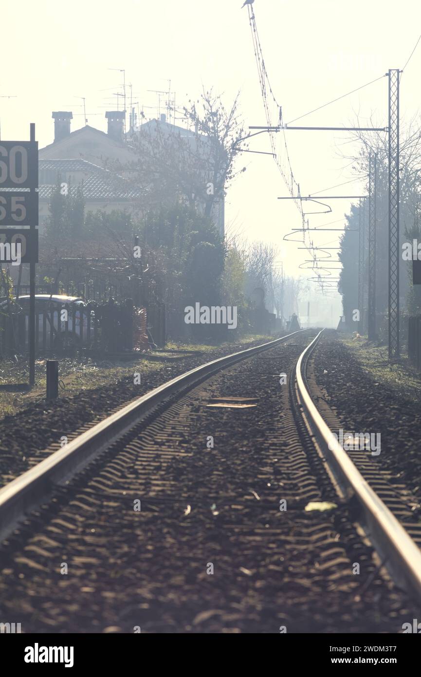 Railroad track passing through a village Stock Photo - Alamy