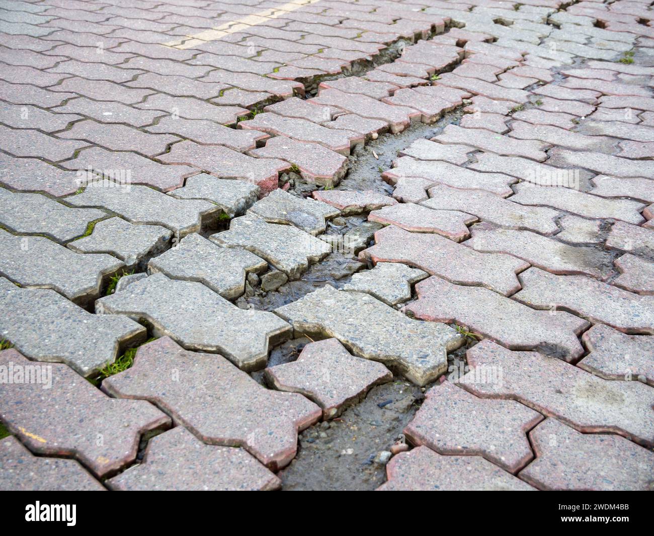 Consequences of poor-quality laying of paving slabs Stock Photo - Alamy