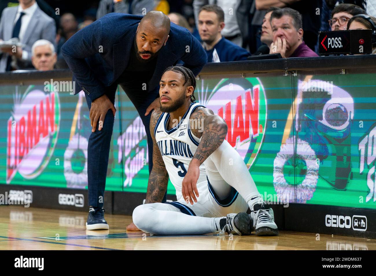 Villanova head coach Kyle Neptune, left, talks things over with Justin ...