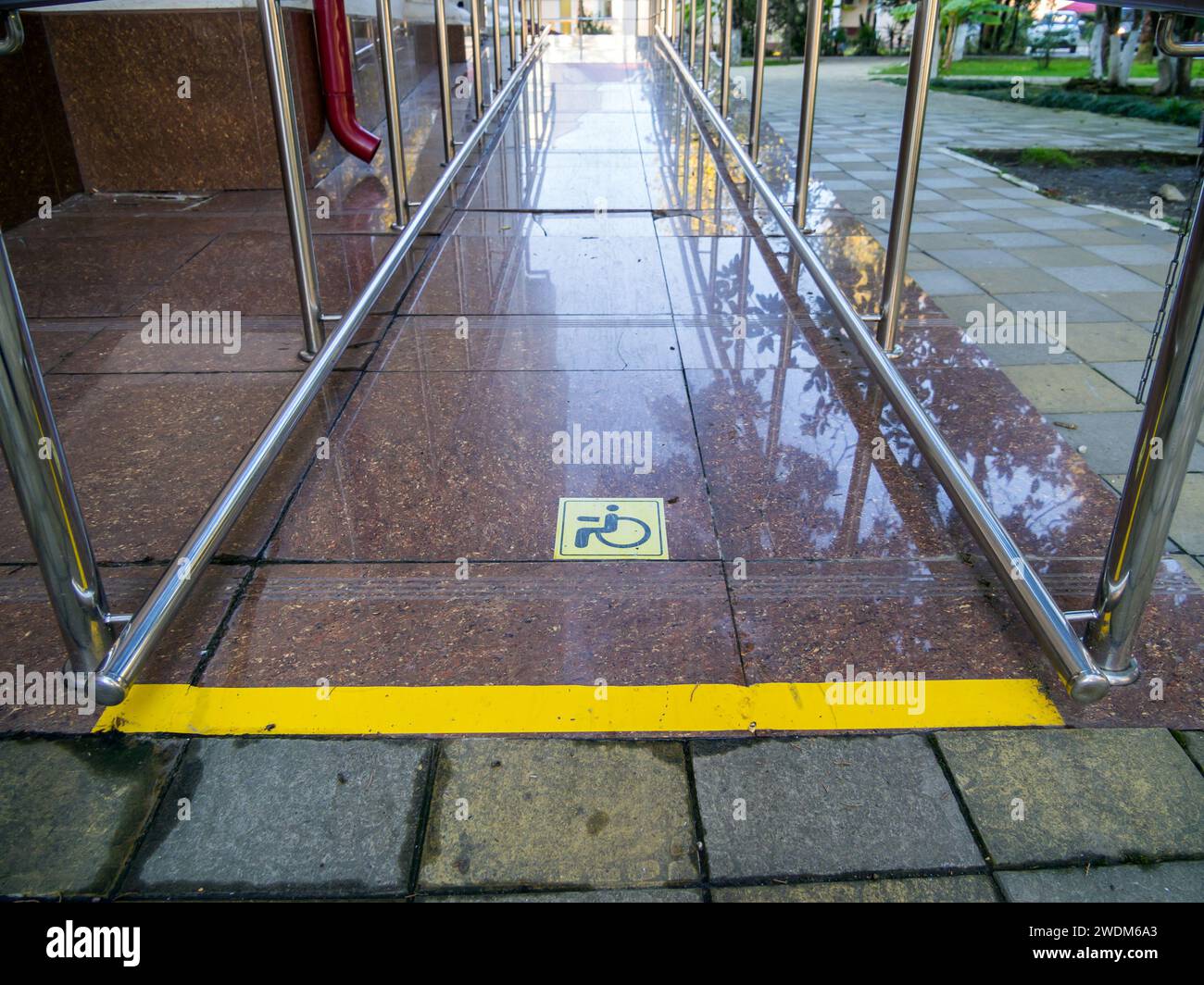 Street ramp for the disabled made of slippery ceramic tiles Stock Photo ...