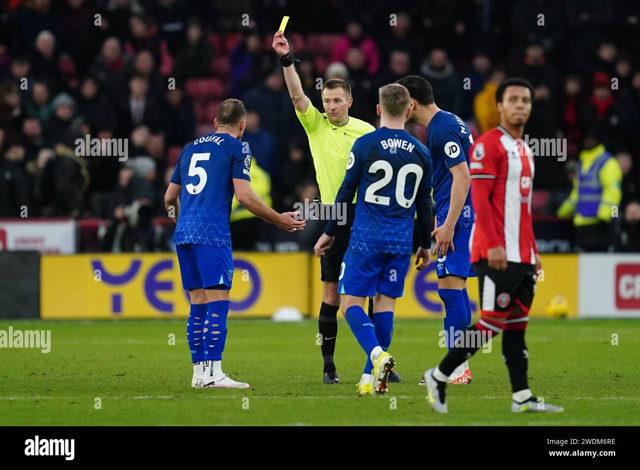 West Ham United's Vladimir Coufal (left) is shown a yelo card by ...