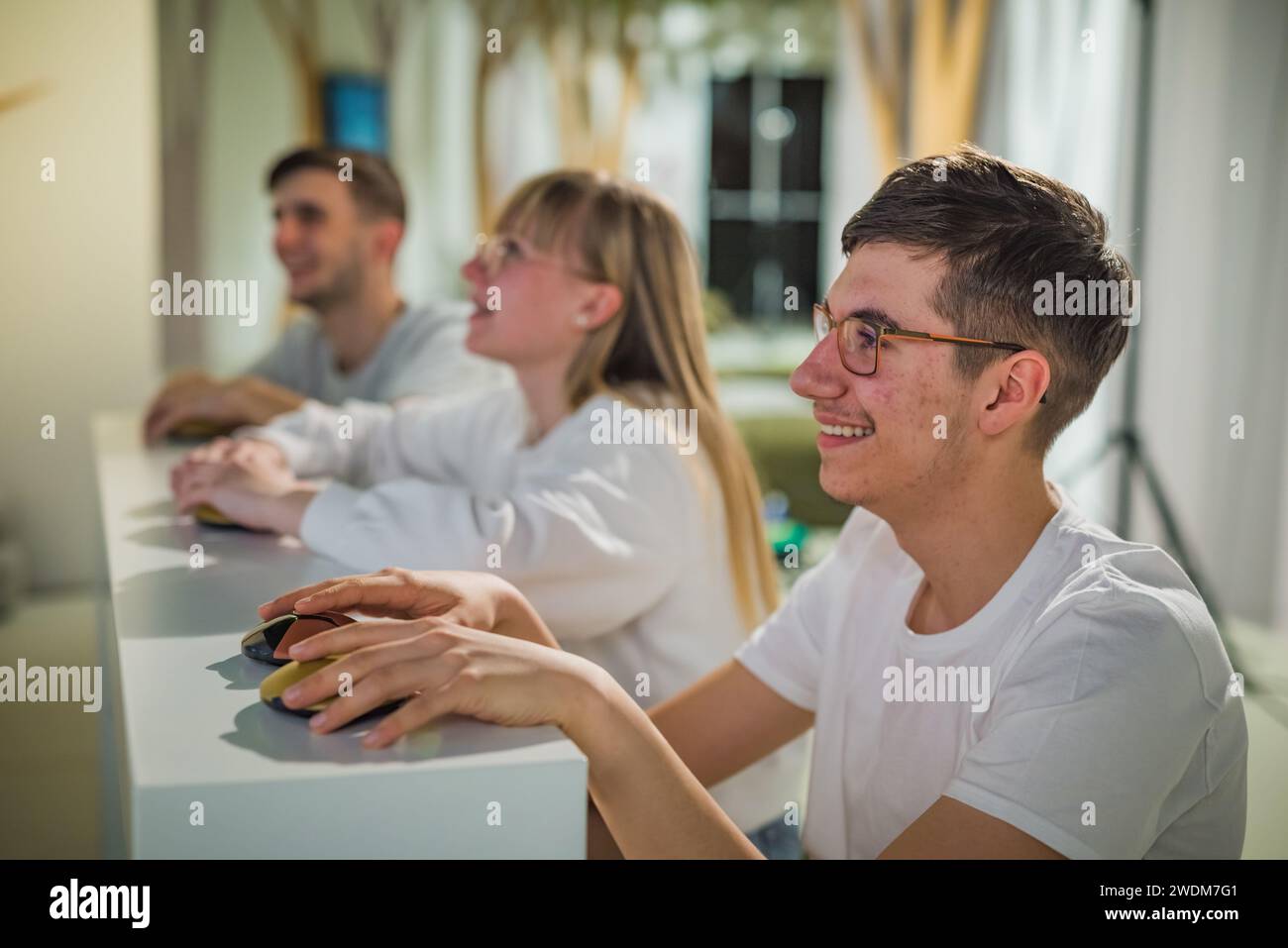 Students at a Quiz Competition with Hands on a Button Stock Photo - Alamy