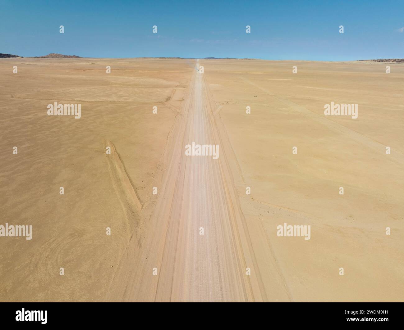 Aerial view of a straight desert road viewed by drone on the C14 Road ...