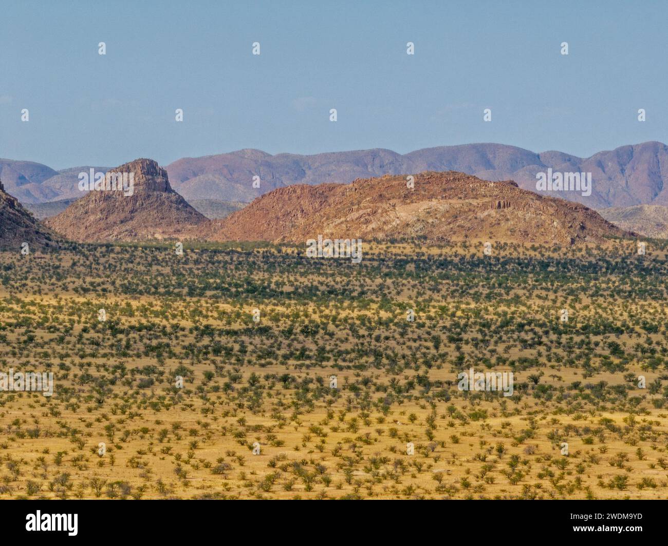Aerial view of a desert landscape with red granite hills around the ...