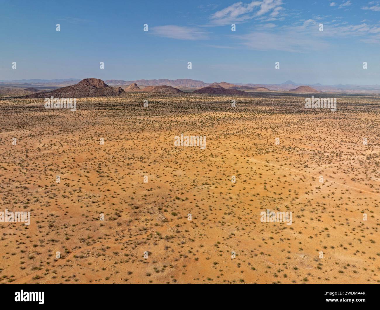 Aerial view of a desert landscape with red granite hills around the ...
