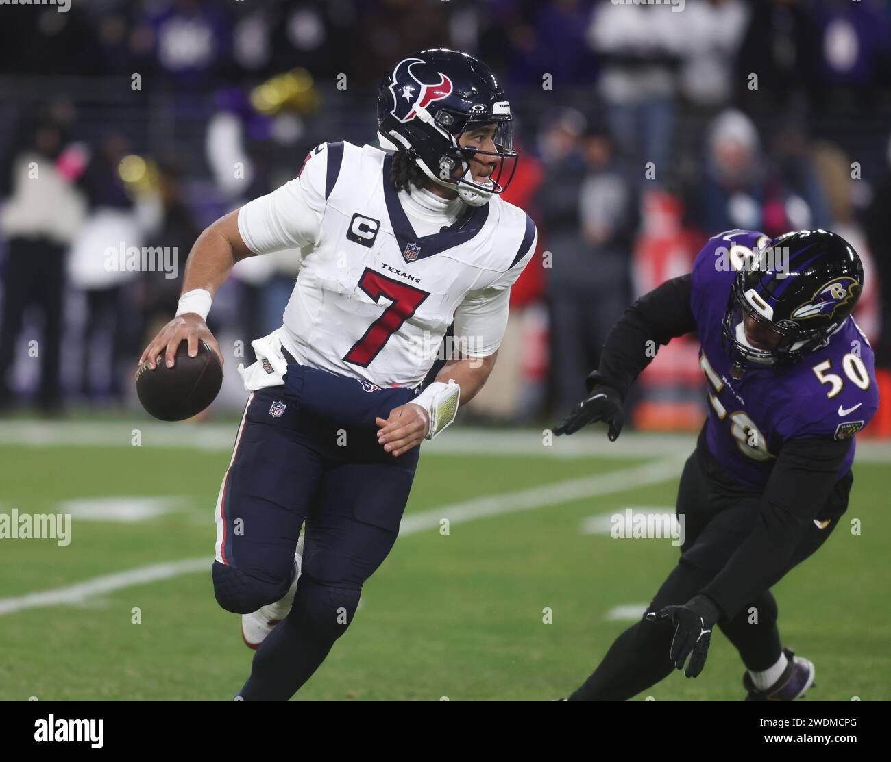 January 20, 2024: Houston Texans QB C.J. Stroud (7) is pursued by Baltimore Ravens OLB Kyle Van ...