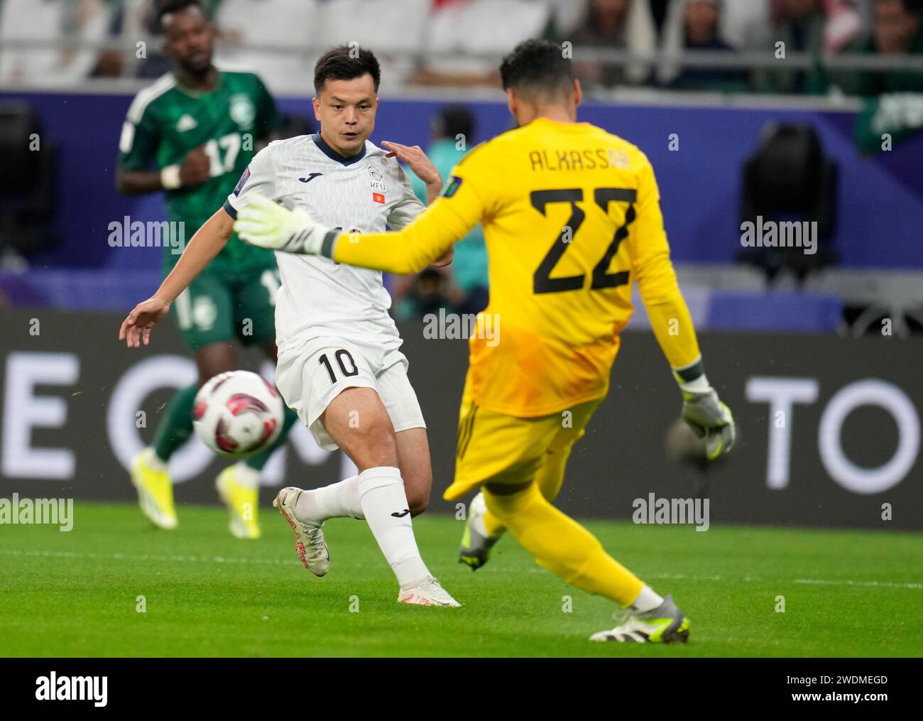 Saudi Arabia's goalkeeper Ahmed Alkassar stops the ball next to ...