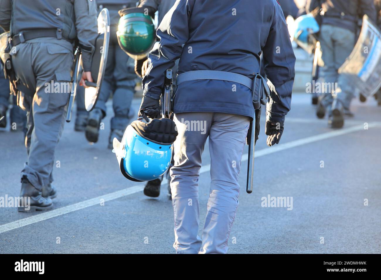 many policemen in uniform with riot gear during the protest ...