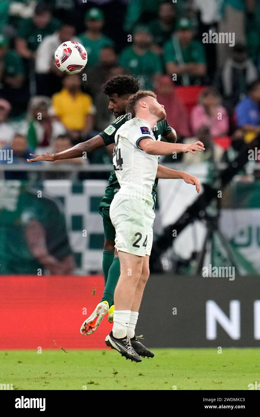 Saudi Arabia's Sami Alnaji, background, and Kyrgyzstan's Merk Kimi Bern ...